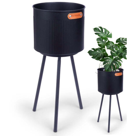Stylish black metal pot with grooved surface and three legs 88323