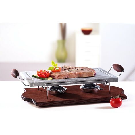 Gran esteatita rectangular con estructura cromada y estufa sobre base de madera de wengué